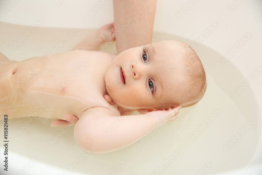 Cute baby bathing Stock Photo | Adobe Stock