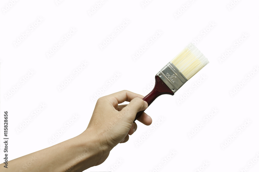 Painting, hand holding the paint brush. Stock Photo | Adobe Stock