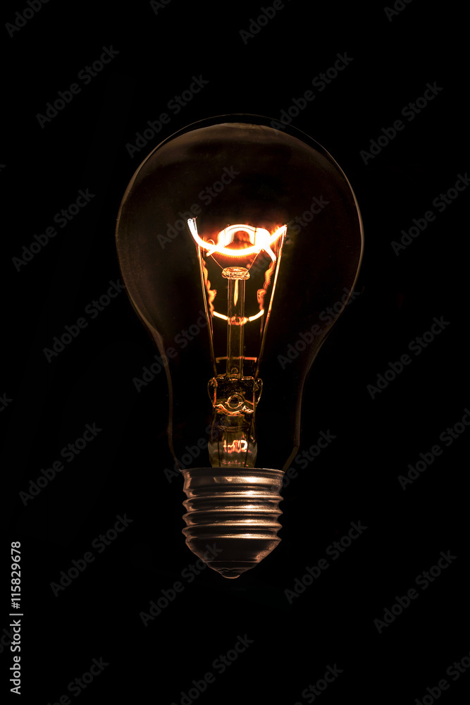 Glowing light bulb without wires on black background Stock Photo ...