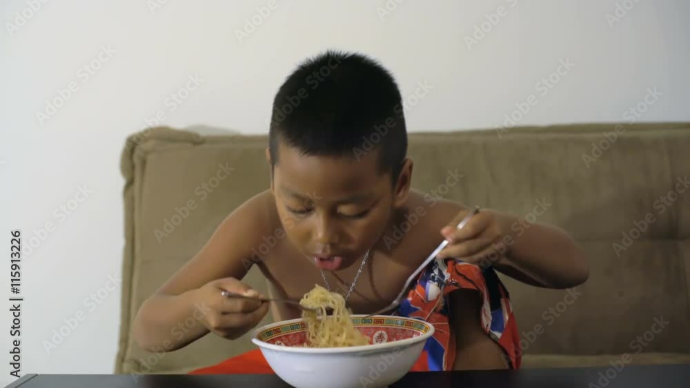 Little Thai boy enjoying instant noodles 4k UHD (3840x2160) Stock Video ...