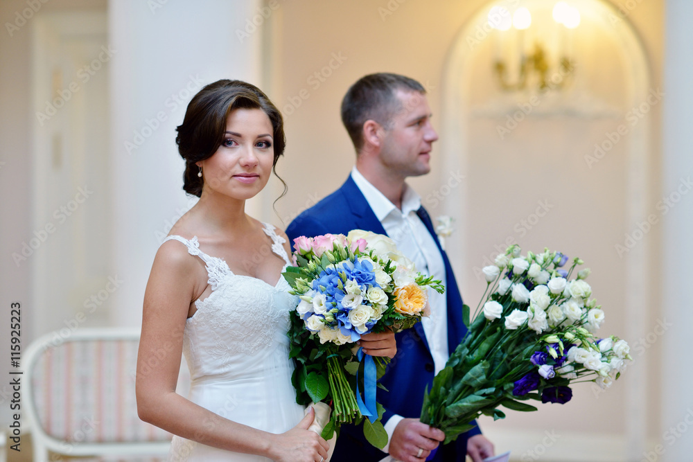 Beauty bride and handsome groom are registering the marriage. Wedding ...