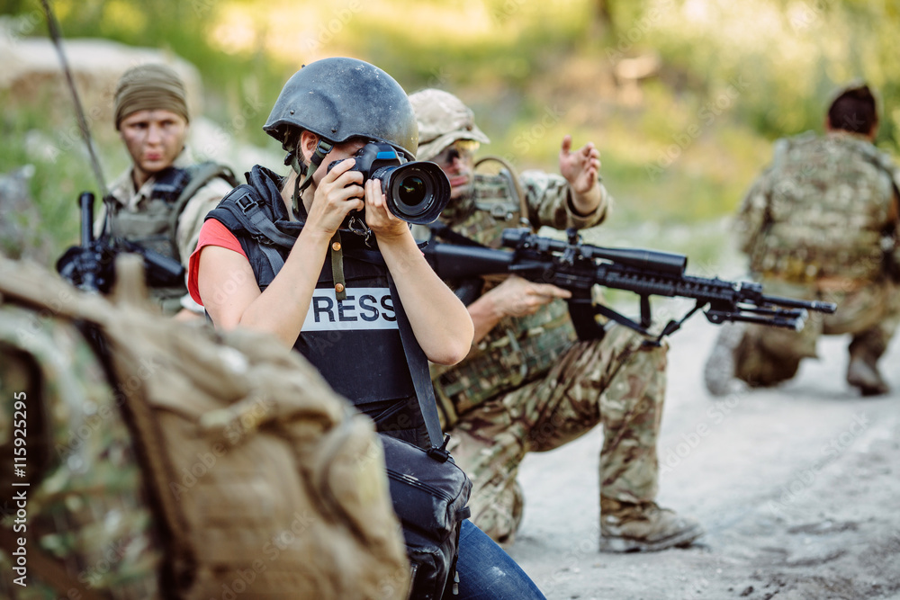 Photojournalist documenting war conflict. in the mountain. Stock Photo ...