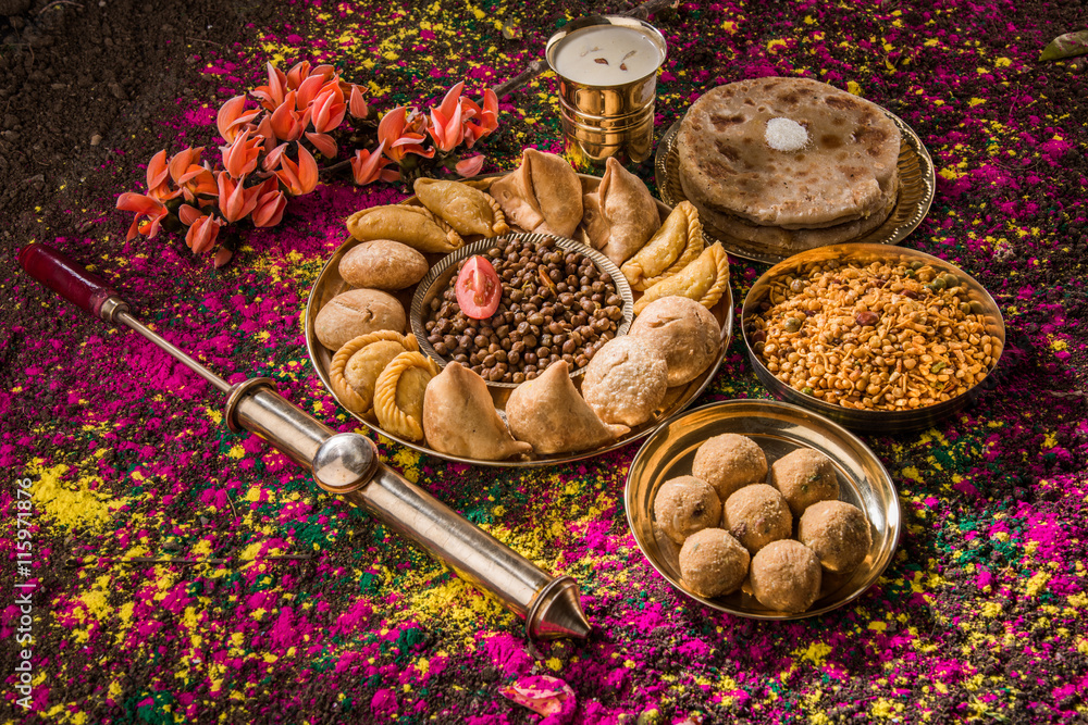 holi festival food with colours, indian festival holi, samosa, kachori ...