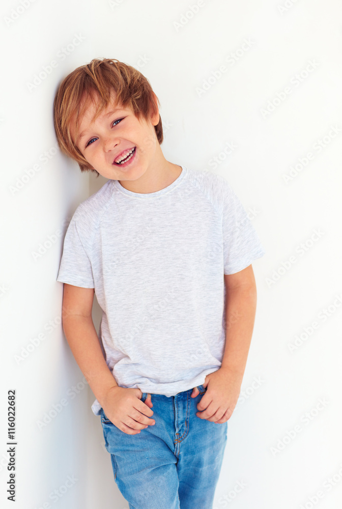 handsome young boy, kid posing near the white wall Stock Photo | Adobe ...