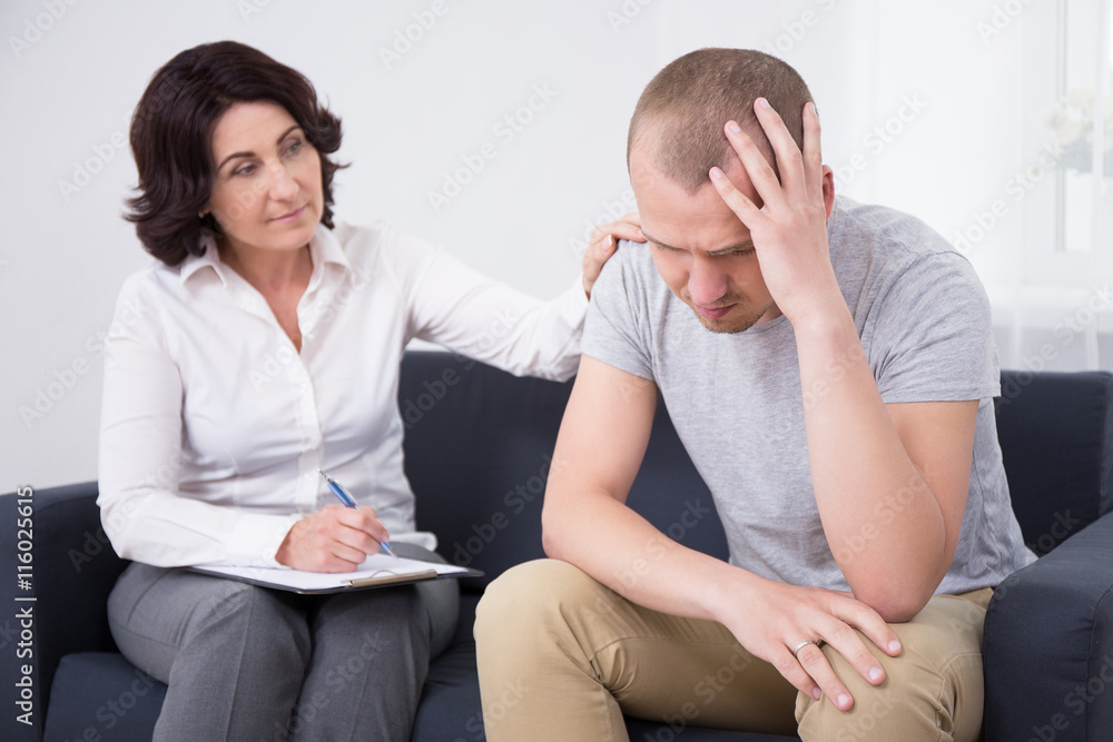 sad man talking about his problems with doctor Stock Photo | Adobe Stock