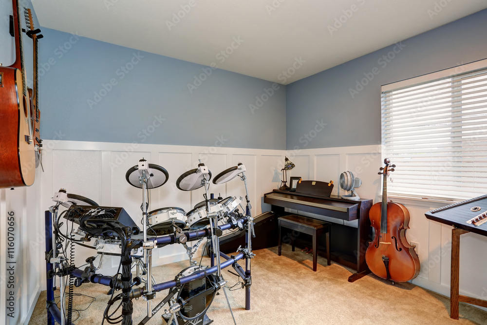 Musician's room interior with drum set, guitars and piano. Stock Photo ...