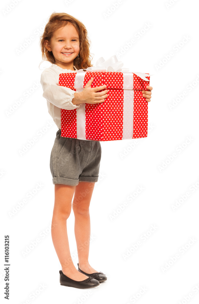Full height portrait of little girl with present Stock Photo | Adobe Stock