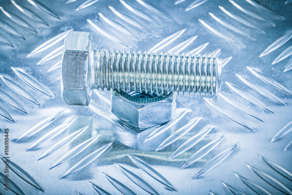 Screwbolt and screw-nut on fluted metal plate construction conce Stock ...