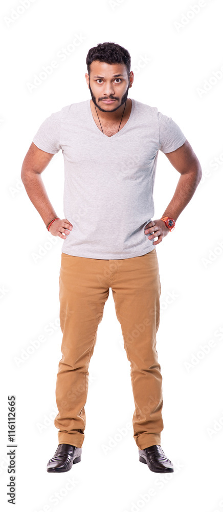 Serious cutout latino man with beard holding hands on his waist. Full ...