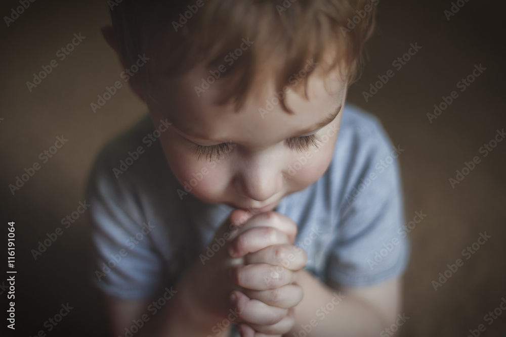 Cute Young Boy Praying Stock Photo | Adobe Stock