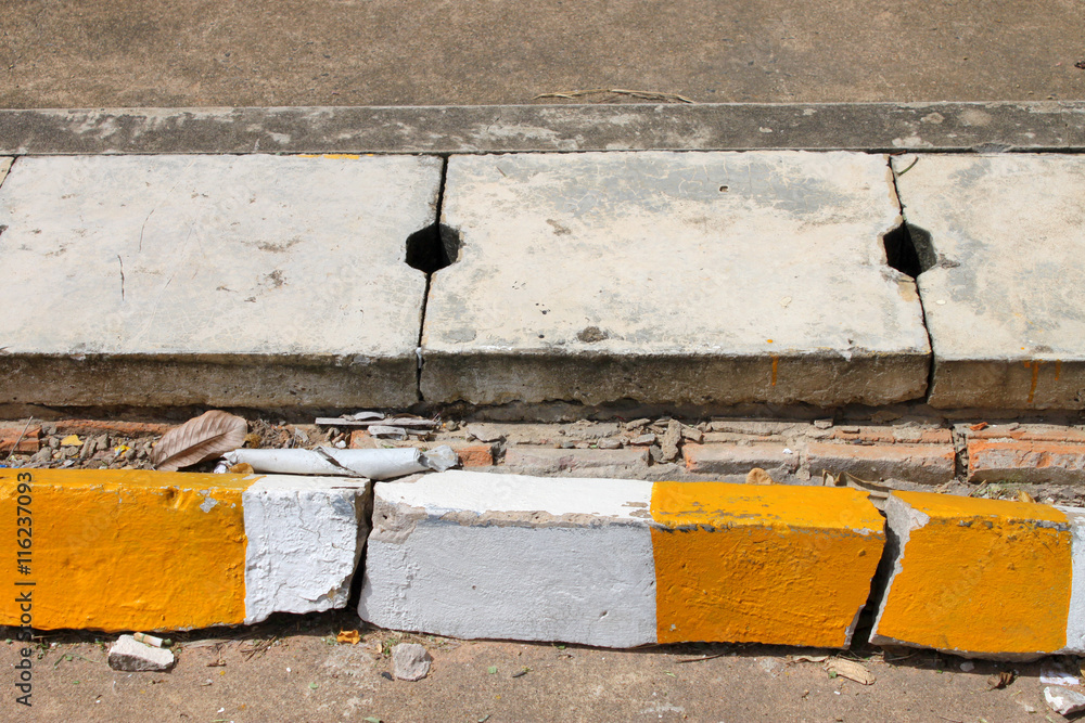 manhole and warning sign of white and yellow color on road Stock Photo ...