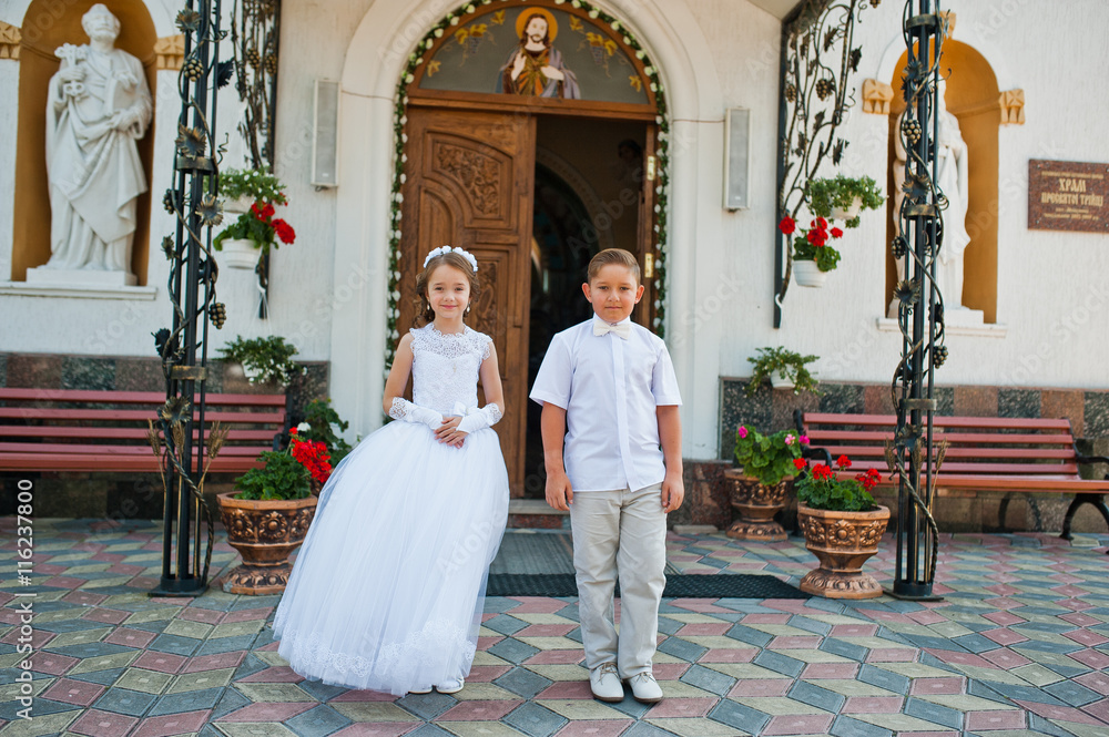 First holy communion, brother and sister stay at white dress bac Stock ...