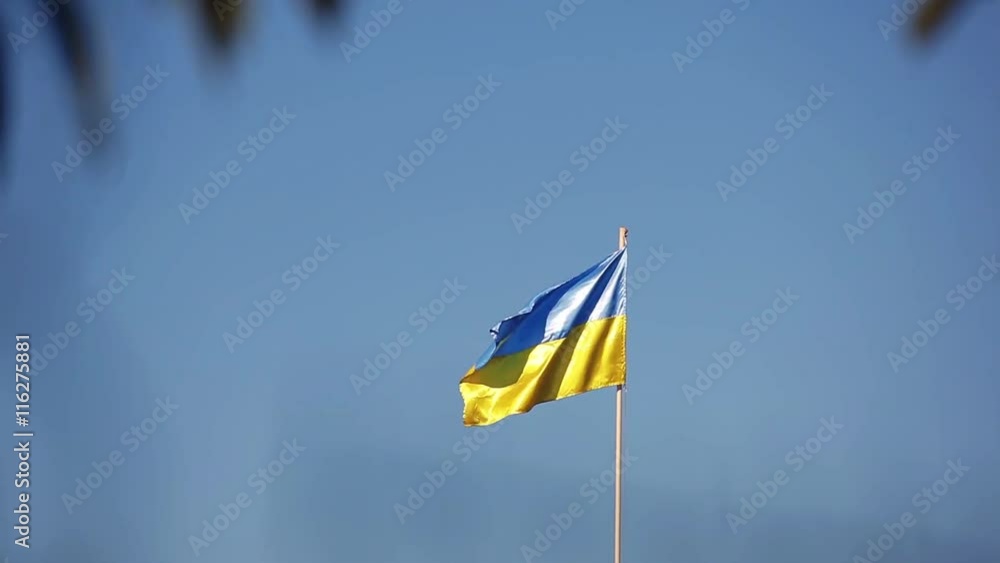 Ukrainian flag in the distance. Ukrainian flag flies on the sky ...