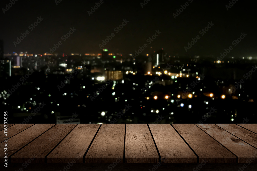 wood table top on night city background Stock Photo | Adobe Stock