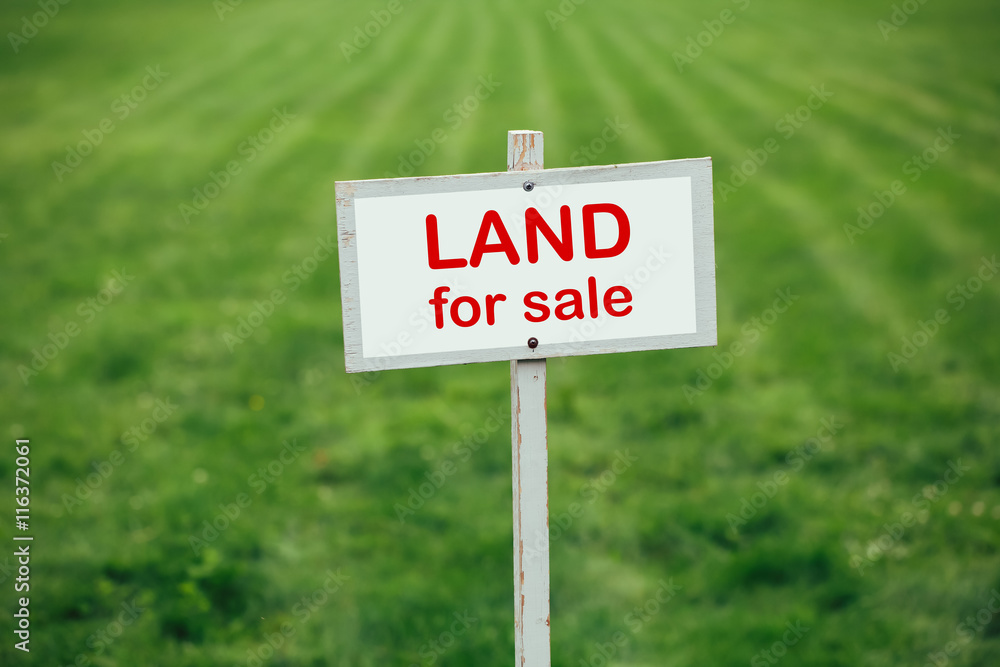 land for sale sign against trimmed lawn background Stock Photo | Adobe ...