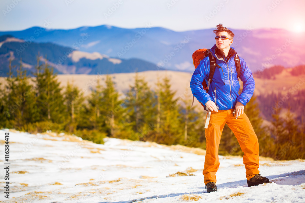 Portrait of mountaineer with mountains in the background. Stock Photo ...