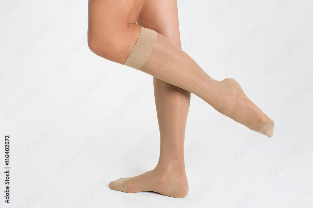 Female legs in socks on white background Stock Photo | Adobe Stock
