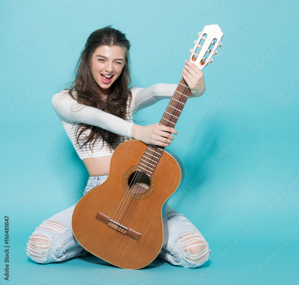beautiful young girl posing with guitar Stock Photo | Adobe Stock