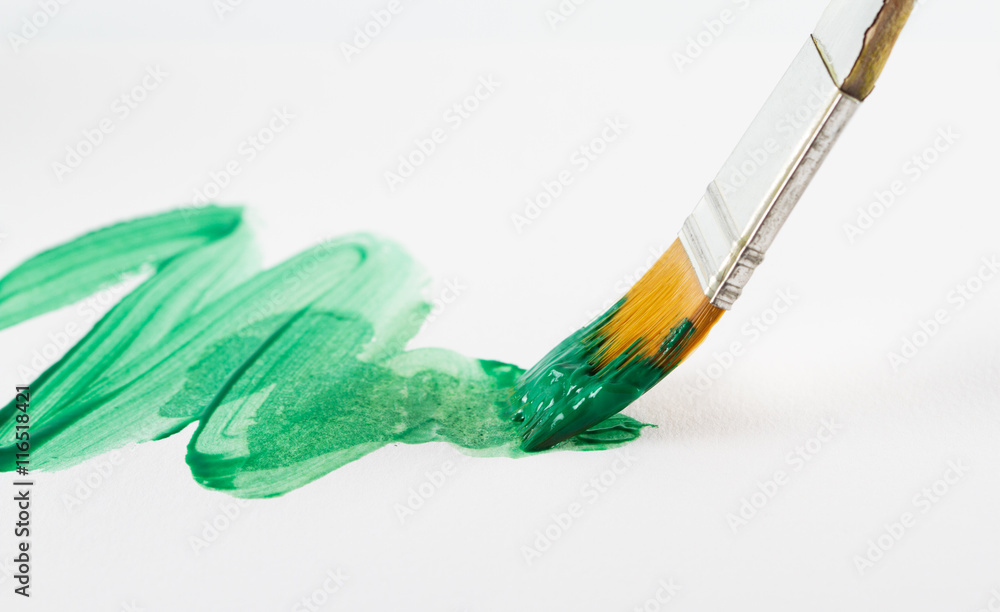 Paint brush with green paint Stock Photo | Adobe Stock