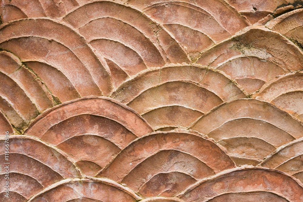 closeup old orange fish scales pattern on the wall texture background ...