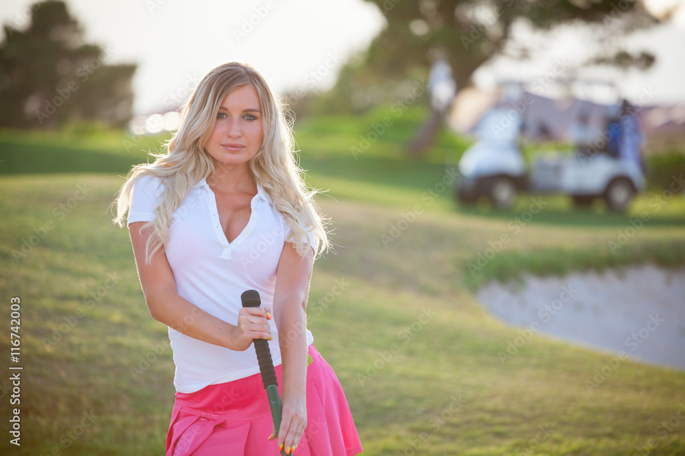 Female golfer caddy raking sand on golf course with copy space. Stock ...