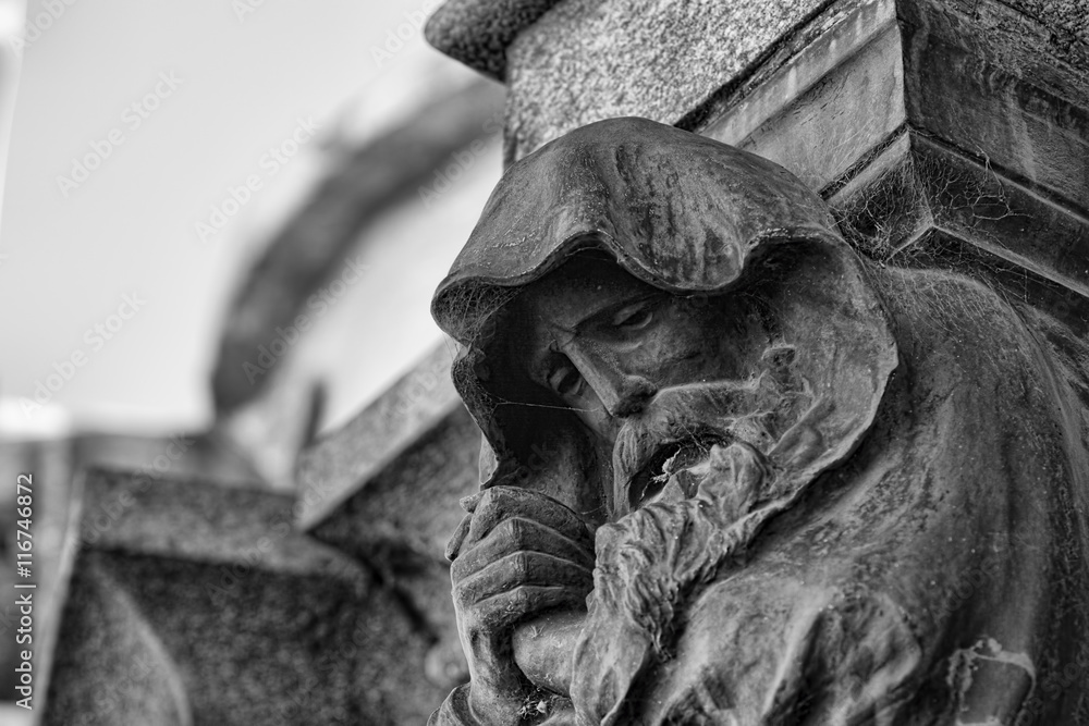 Statue of hooded old man Stock Photo | Adobe Stock