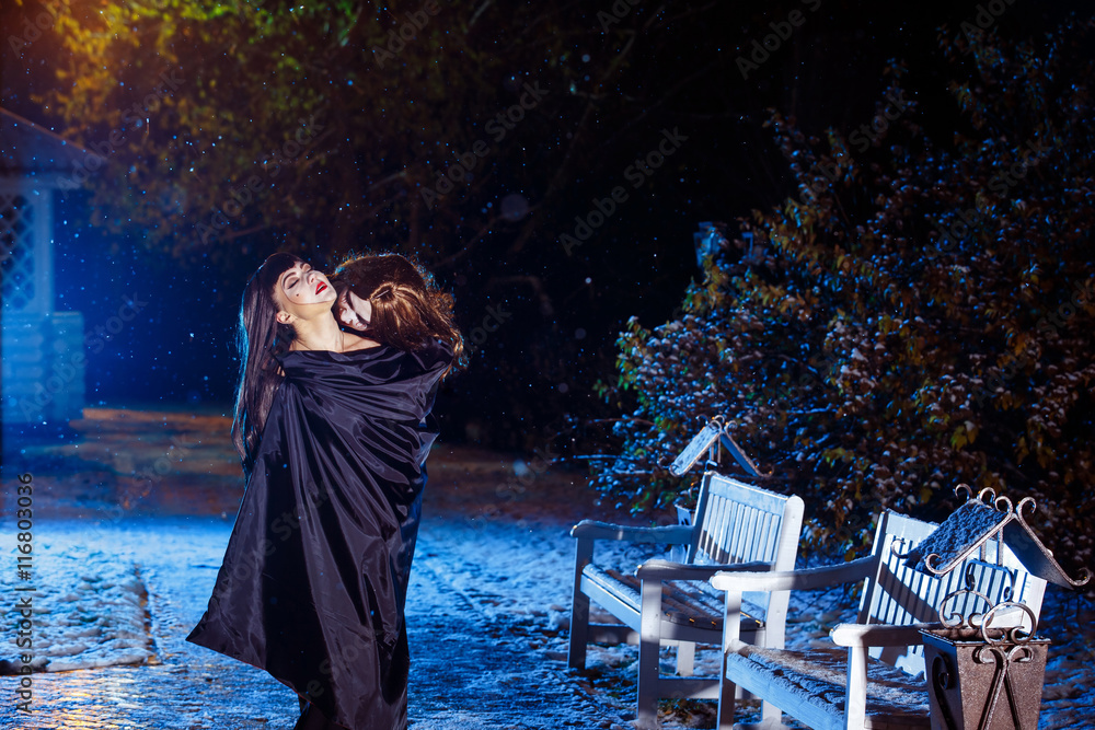 Portrait of a vampire girl drinking blood of victim outdoors Stock ...