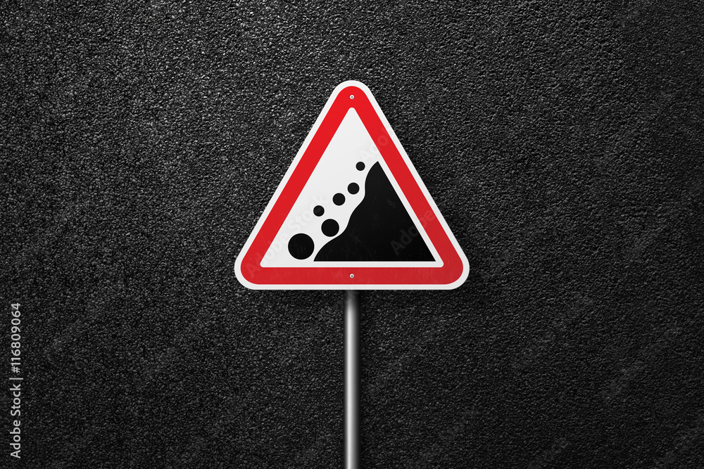 Road sign triangular shape with a picture of the rockfall on a ...
