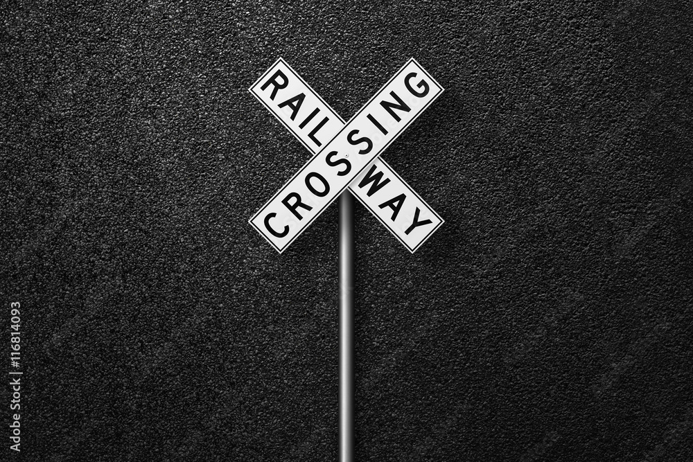 Road sign on a background of asphalt. RAIL WAY CROSSING. The texture of ...