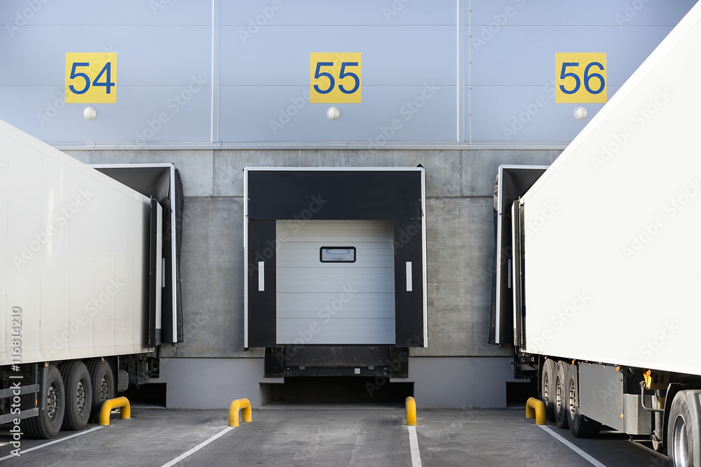 Trucks while loading in a big distribution warehouse Stock Photo ...