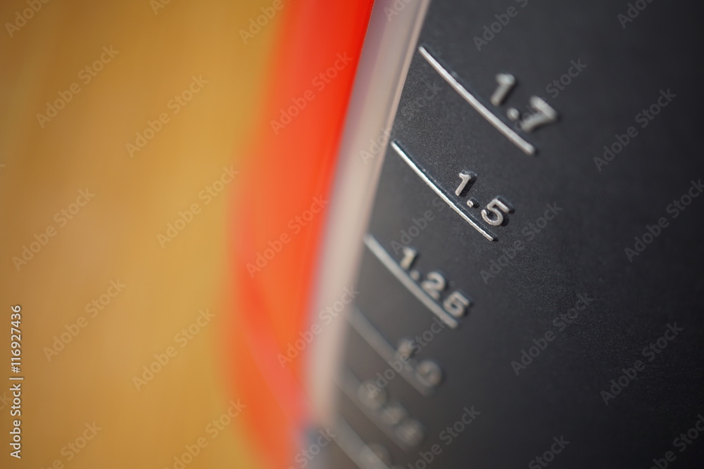 Silver scale measuring the volume of liquid (displaying units in liters ...