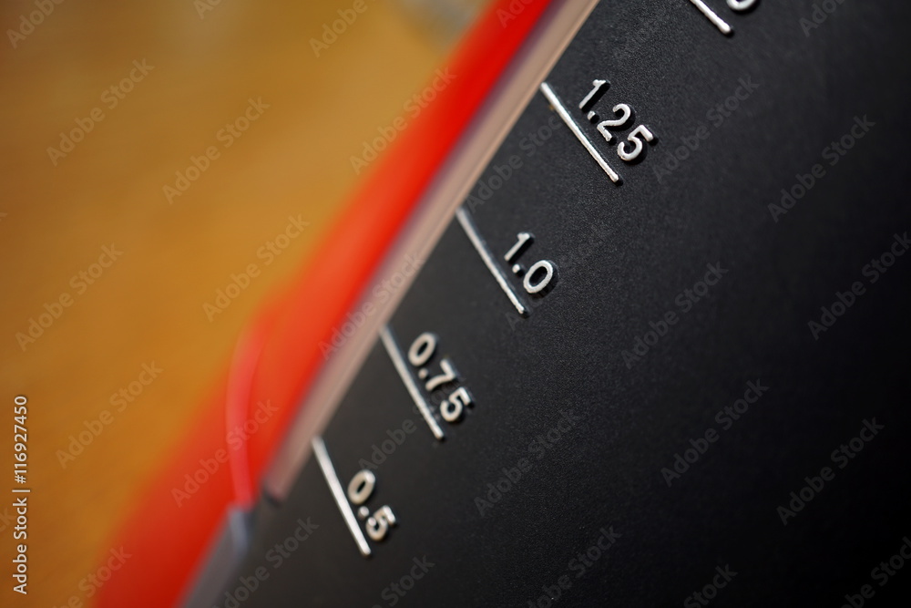 Silver scale measuring the volume of liquid (displaying units in liters ...