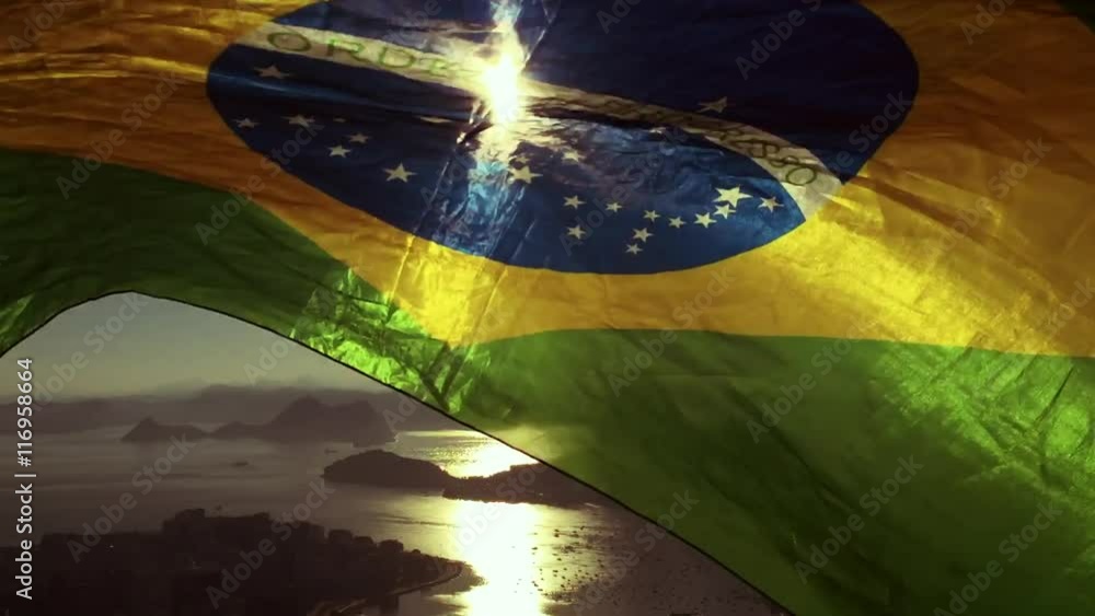 Brazilian flag flying above skyline scenic overlook of Rio de Janeiro ...