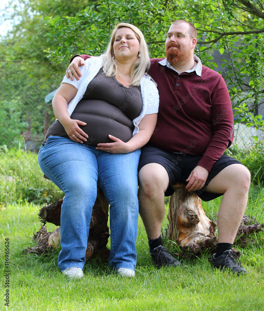 Overweight couple. Healthy lifestyle concept. Obese adults on garden ...