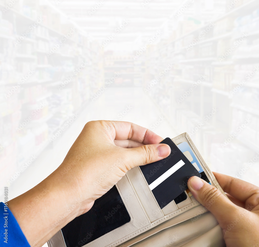 Hands pull credit card out of wallet with space area background Stock ...