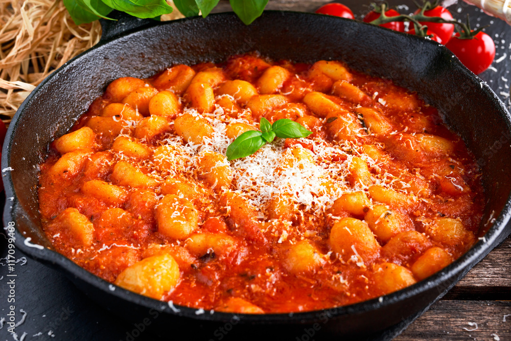Homemade Italian Gnocchi with marinara sauce, cheese in iron pan Stock ...