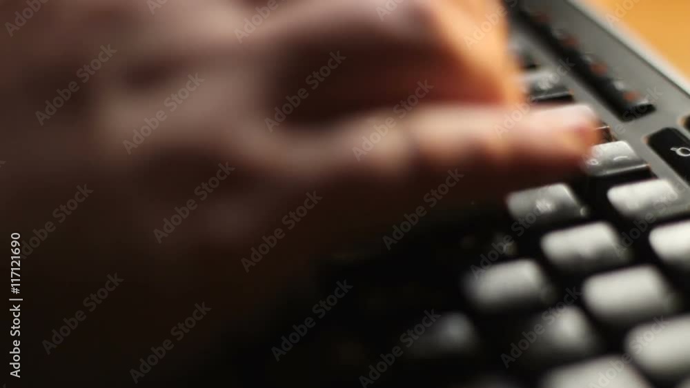 Desktop Keyboard Typing Back View. The camera trucks along a close up ...