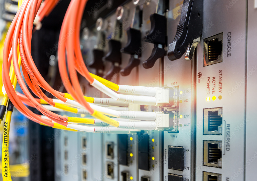 Fiber optic cable connect to ethernet switch mount on rack. Stock Photo ...