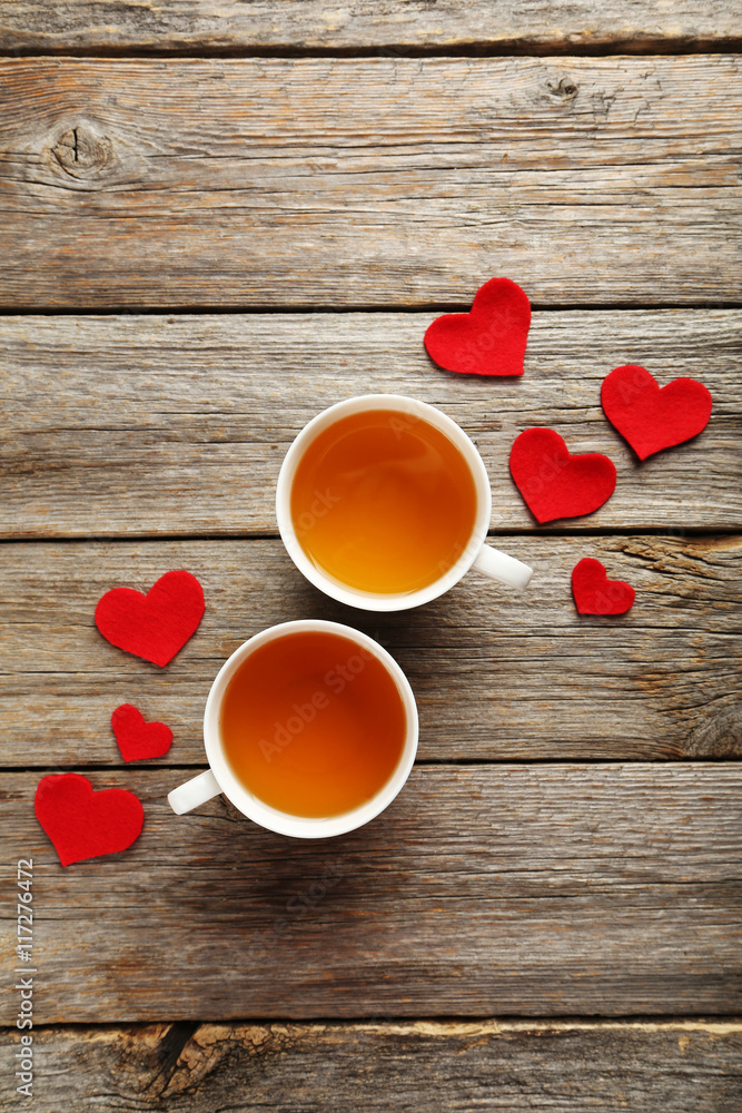 Love hearts with cups of tea on a grey wooden table foto de Stock ...
