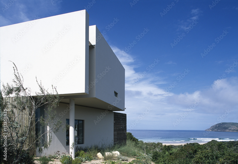 Side view of modern white geometric house. Stock Photo | Adobe Stock