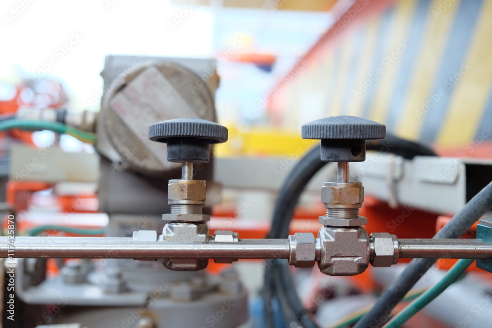 Pneumatic valve at an oil and gas industrial. Stock Photo | Adobe Stock
