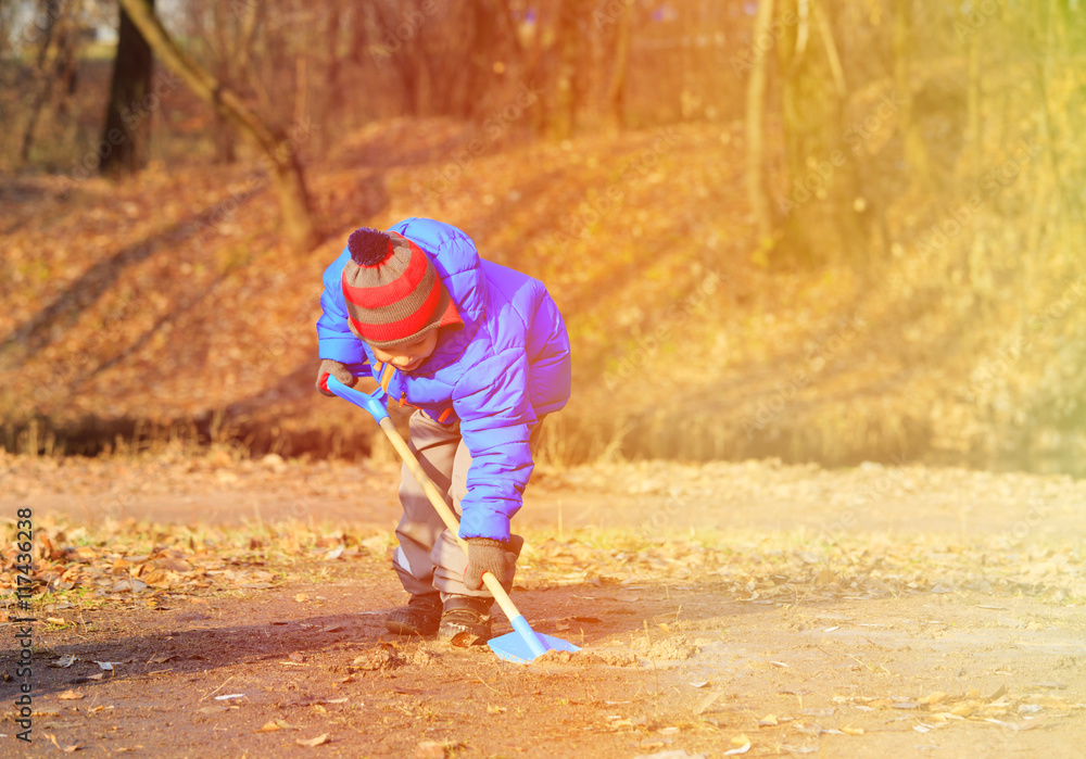 little boy digging in fall, autumn kids activities Stock Photo | Adobe ...