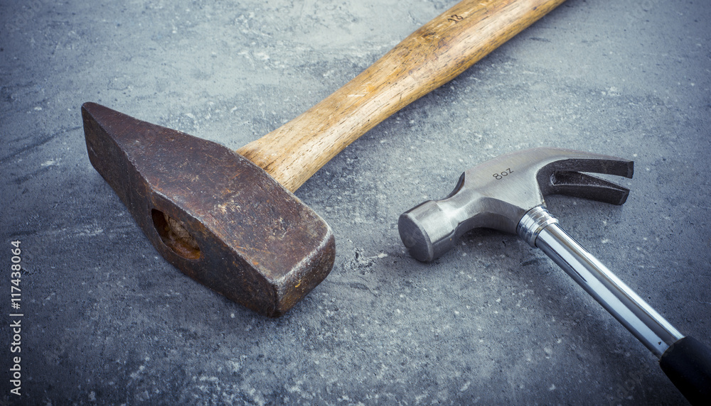 Hammer still life. Two hammers side by side on a stone workbench ...