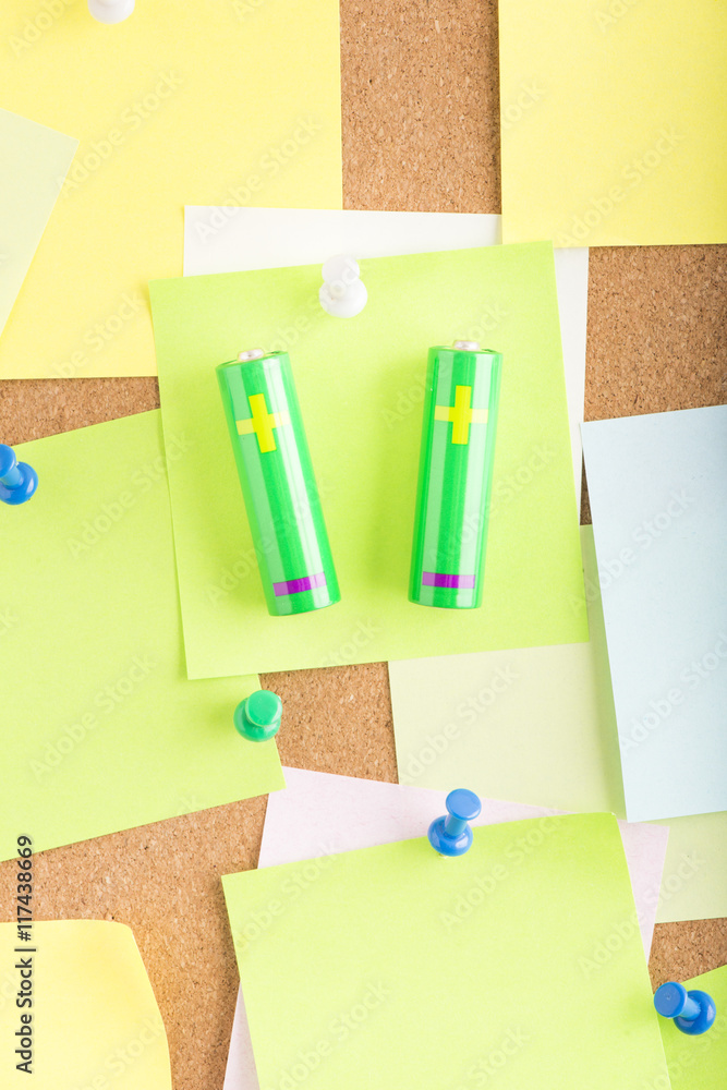 Green energy in office, AA batteries as reminder on notice board ...