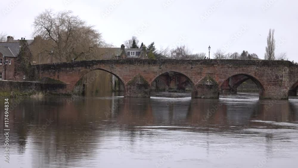 Dumfries Scotland city center River Nith bridge to waterfall rainy day ...