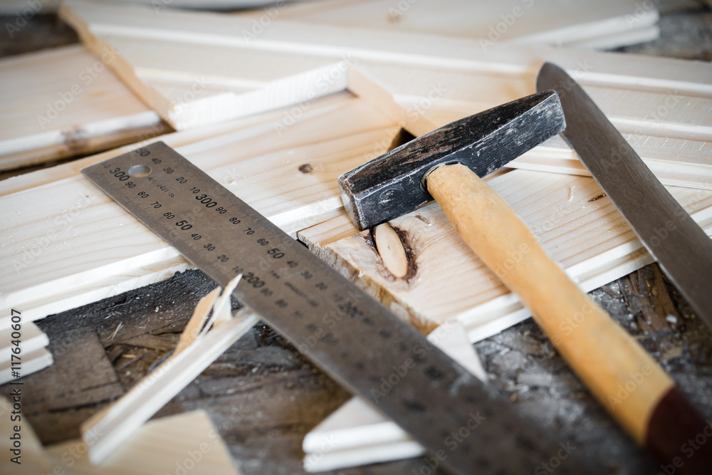 Hammer, knife, ruler and tongue and groove boards on working pla Stock ...