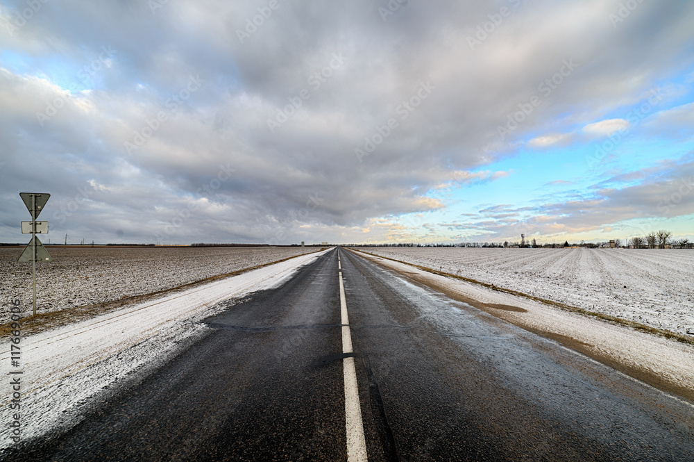 Empty paved road, built among agricultural fields. Stock-Foto | Adobe Stock