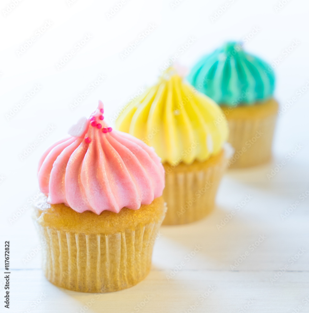 Colorful cupcake muffins soft focus on the front muffins. Cute party ...