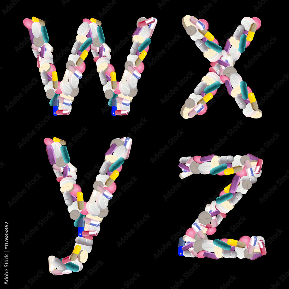 over black background medication colored alphabet letters from tablets ...