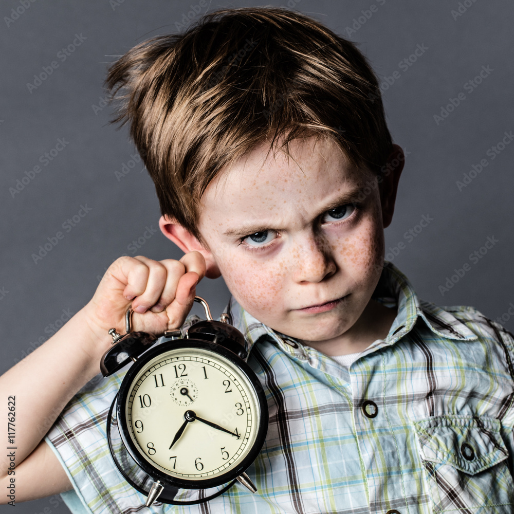 impatient young boy with a dark look reproaching alarming deadlines ...